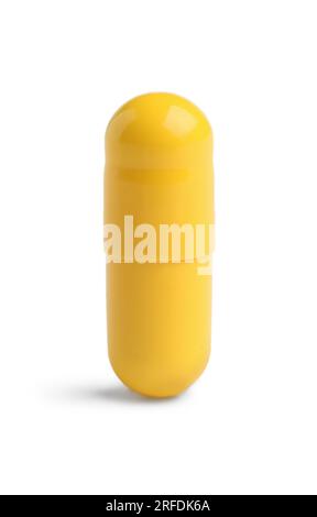 One yellow pill on white background. Medicinal treatment Stock Photo ...