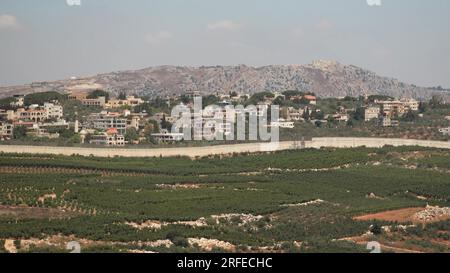 The seven-meter high security wall separating the Lebanese village of ...