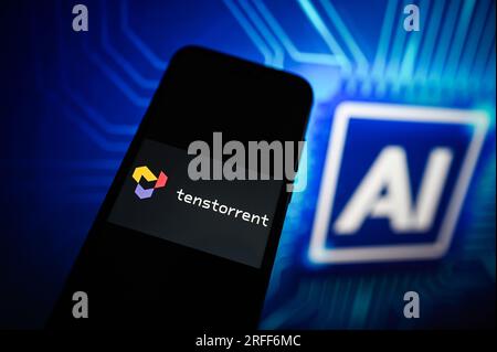 In this photo illustration, Tenstorrent logo seen displayed on a smartphone with tech hardware ...