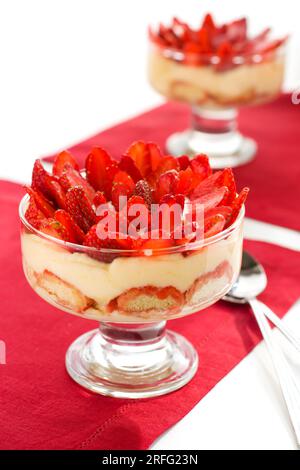 Tasty tiramisu dessert in glass, on wooden background Stock Photo - Alamy