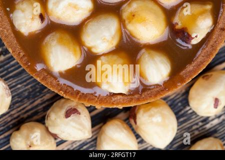 tartlet with salted caramel and hazelnuts, round tartlet with soft ...