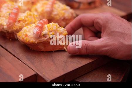 hand holding a traditional basque appetizer Stock Photo - Alamy