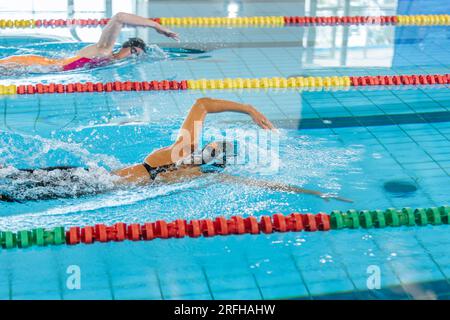 Two female swimmers during a race in the freestyle swim discipline ...
