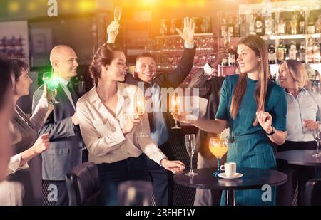 Two girls talking on corporate party Stock Photo - Alamy