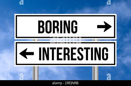 Boring or interesting road sign on sky background Stock Photo - Alamy