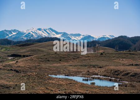 Snowy Pindus mountain range background, region Aoos Springs Lake ...