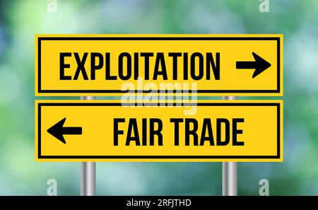 Exploitation or fair trade road sign on blue sky background Stock Photo ...