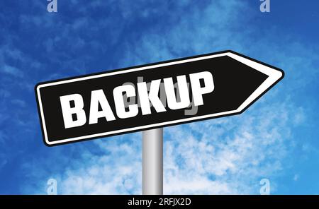 Backup road sign on blue sky background Stock Photo - Alamy
