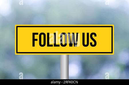 Follow us road sign on cloudy sky background Stock Photo - Alamy