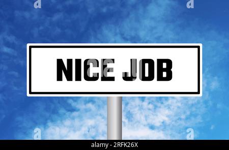 Nice job road sign on blur background Stock Photo - Alamy