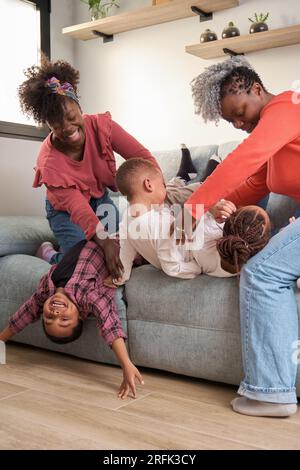 Extended African family playing on the beach together Stock Photo - Alamy