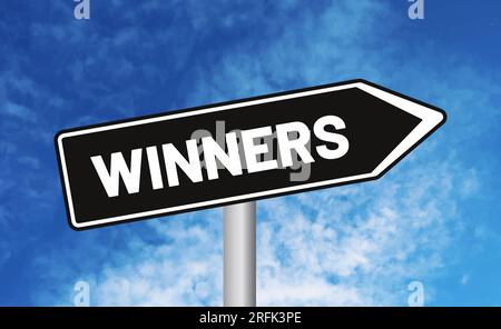 Winners road sign on blue sky background Stock Photo - Alamy