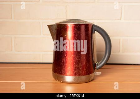 A broken old used electric kettle. Kitchen Accessories. High quality ...