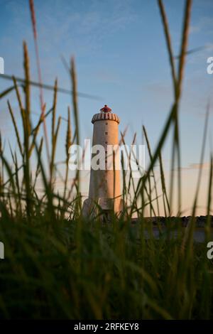 Grassy ground under a blue cloudy sky in Lonstrup, Denmark Stock Photo ...