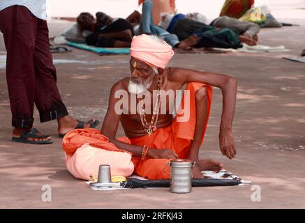 A monk sitting at the Triveni Ghat in Rishikesh Stock Photo - Alamy
