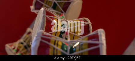 Damru, with the idol of Lord Shiva Parvati With different focus, Damru ...