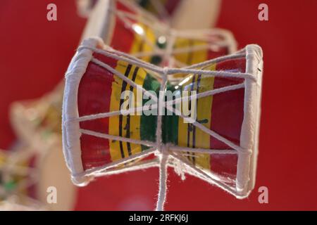 Damru, with the idol of Lord Shiva Parvati With different focus, Damru ...