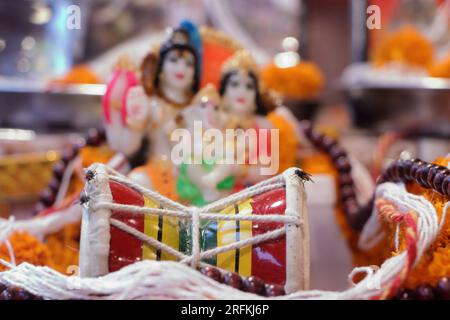 Damru, with the idol of Lord Shiva Parvati With different focus, Damru ...