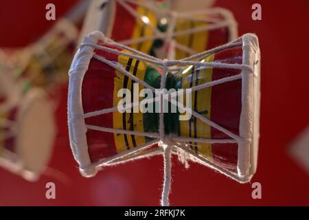 Damru, with the idol of Lord Shiva Parvati With different focus, Damru ...