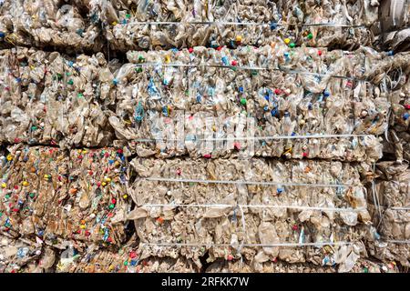 Multiple cubes of compressed plastic garbage near the waste recycling ...