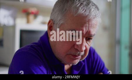 Hopeless senior man struggling with depression alone at home. Close-up ...
