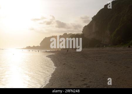 Remote sandy beach during beautiful sunset Stock Photo - Alamy