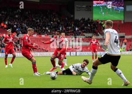Samuel Silvera of Middlesbrough In action with Jeremy Sarmiento of West ...