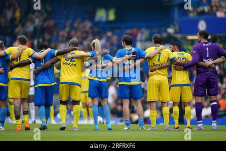 The players from both sides line up to sing the national anthem ahead ...