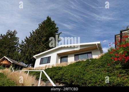 Lush landscaping surrounds homes in Seattle’s affluent North Admiral ...