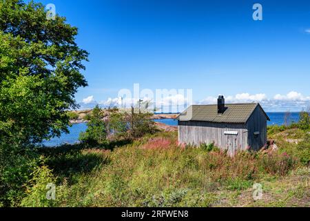 An open wilderness hut at Sommarn island, Inkoo, Finland Stock Photo ...