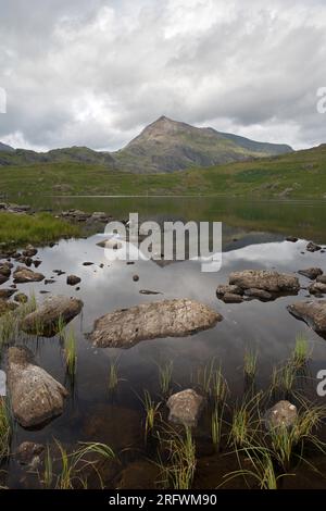 Llyn Cwmffynnon looking towards the peak of Snowdon Yr Wyddfa in the ...