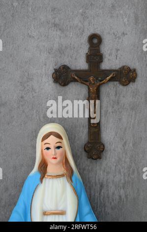Model of Virgin Mary with big blue eyes looking sad and wearing blue ...