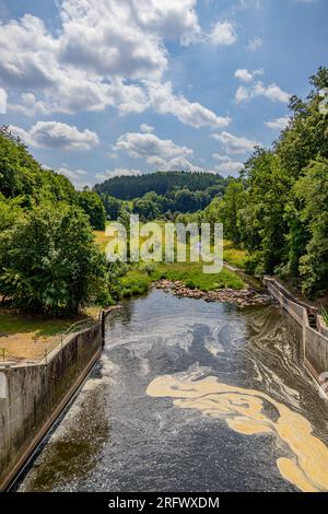 Staumauer Bitburger dam on river Prum, reflection on water surface ...