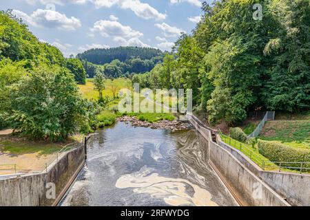 Staumauer Bitburger dam on river Prum, reflection on water surface ...