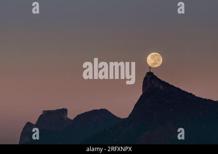 Full moon with Christ the Redeemer in Rio de Janeiro, Brazil - January ...