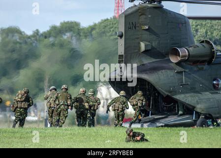 British Army soldiers boarding Royal Air Force helicopter during jungle ...