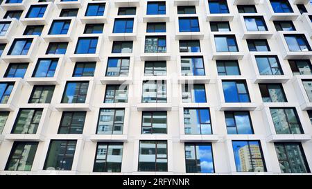 The facade of the new apartment building shaped like cubes. Minimalist ...