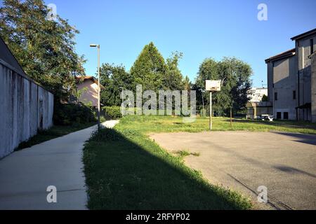Basketball court on the side of a church at sunset in the italian ...