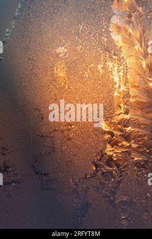 Fire and Ice, Sun shining through ice covered window in Winter Stock ...