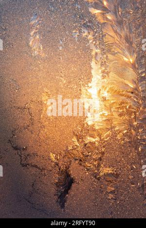 Fire and Ice, Sun shining through ice covered window in Winter Stock ...