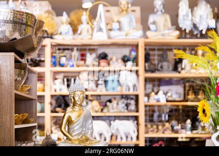 Buddha decorative statues at household goods store Stock Photo - Alamy