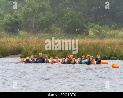 People swimming in Lake Windermere in Ambleside, Lake District, UK ...