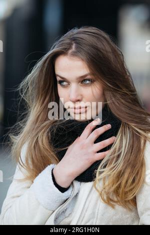 portrait of young a woman with wool scarf Stock Photo - Alamy