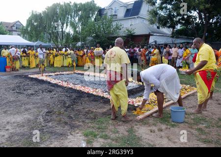Devout Hindu decorate the fire area with flower petals for the Thimithi ...