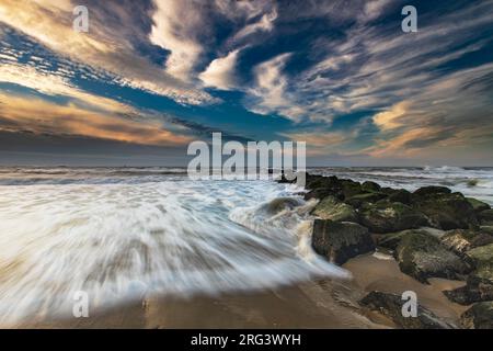 Coastal defense by breakwaters to prevent erosion Stock Photo - Alamy