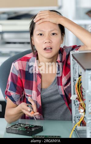 woman trying to fix a pc problem Stock Photo - Alamy