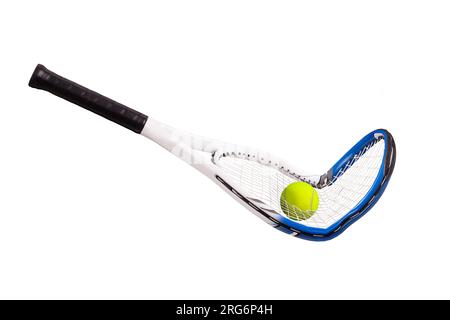 Broken tennis racquet with tennis ball going through the strings on a ...