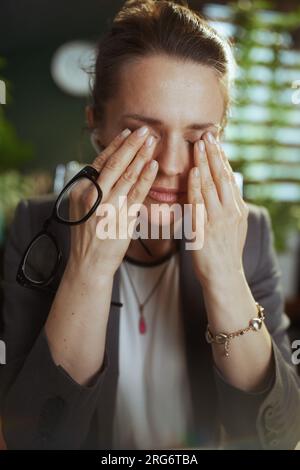 Sustainable workplace. stressed modern business woman in modern green ...
