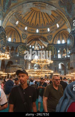 Visit Istanbul concept photo. Hagia Sophia with tourists. Istanbul ...