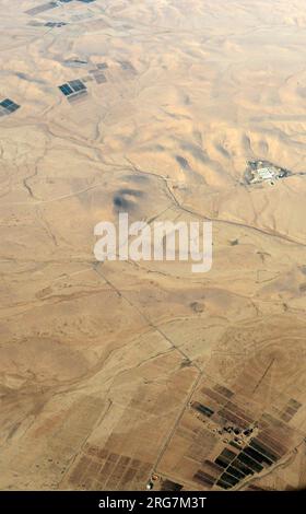 Aerial view of the Jordanian desert with small agricultural farms in ...